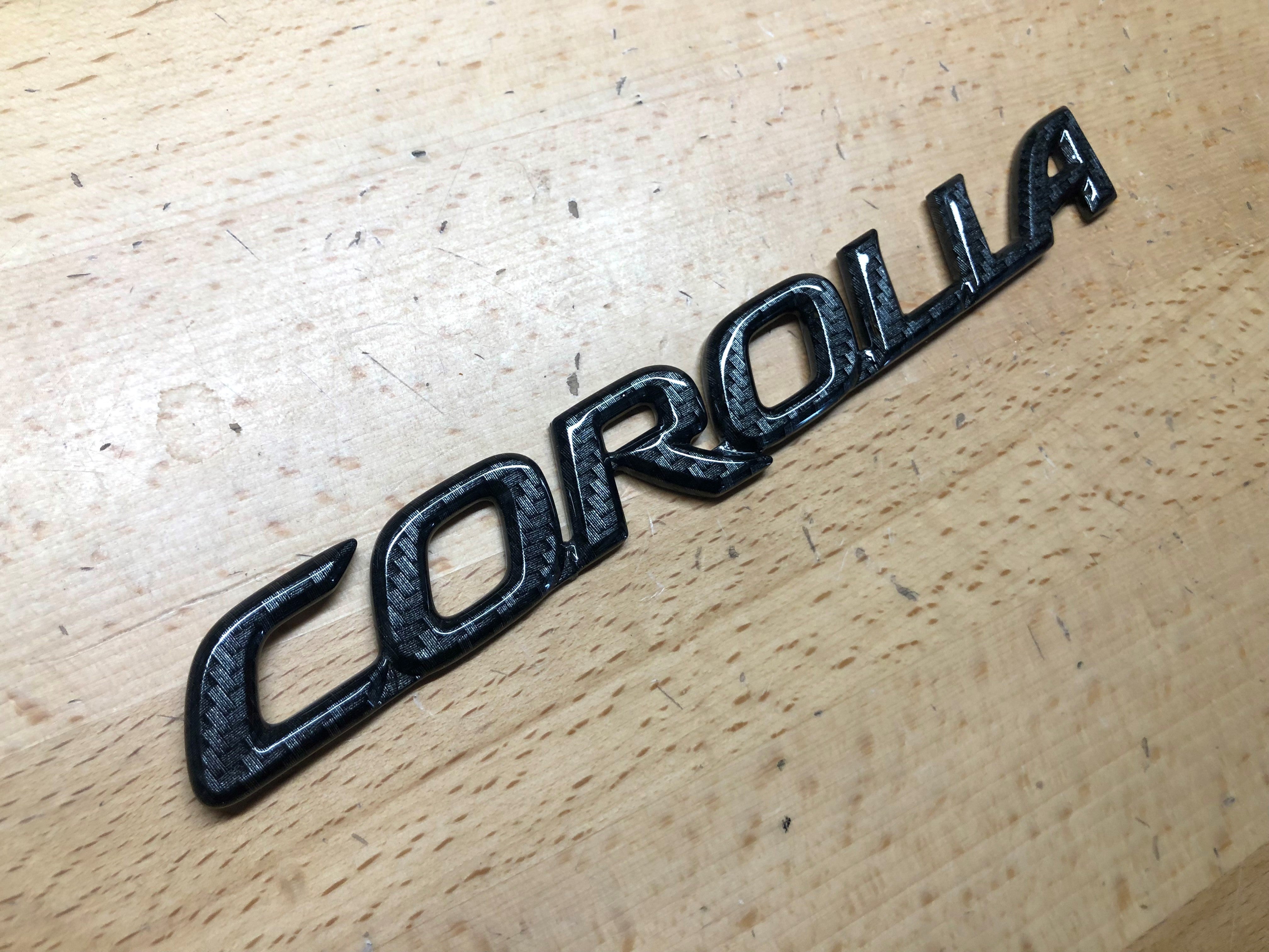 Toyota Corolla Black Carbon Fiber Rear Nameplate – Deep Blue Chrome